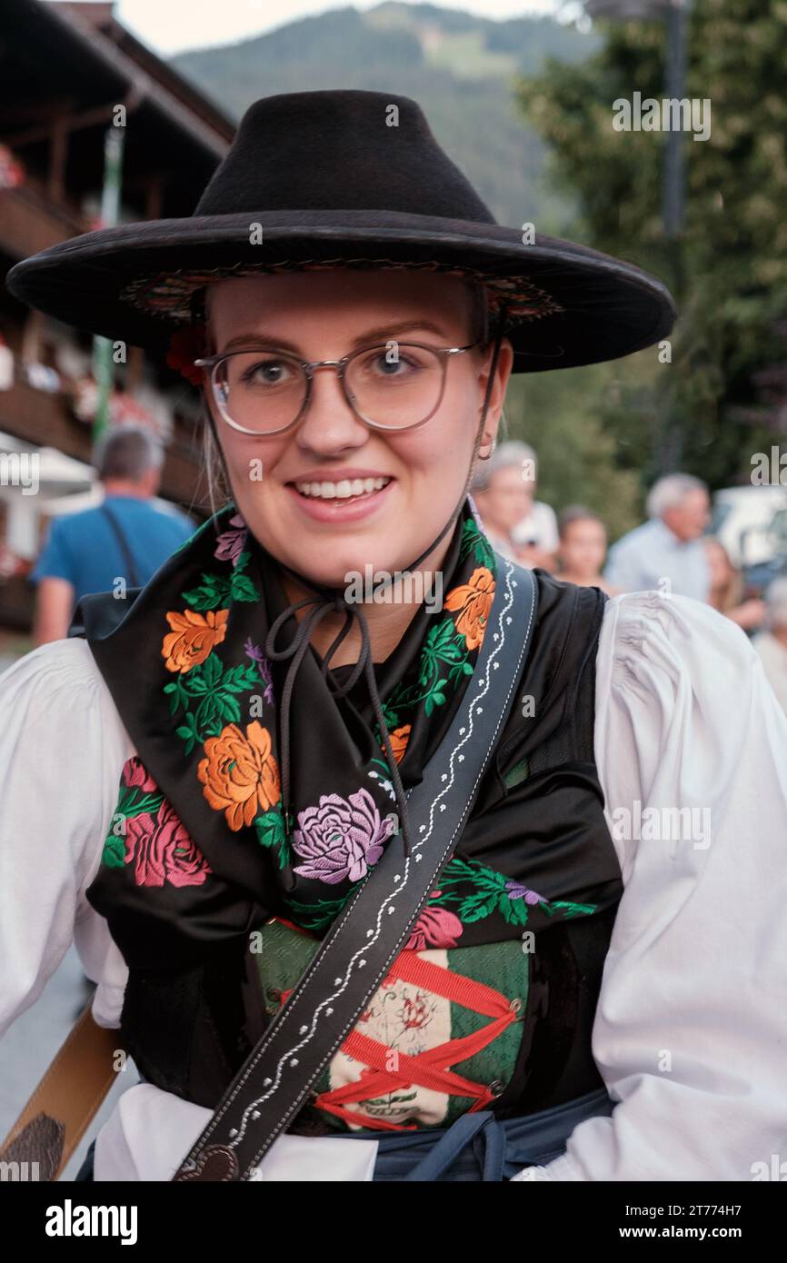 Closeup of smiling female in traditional Tyrolean dress, Alpbach ...