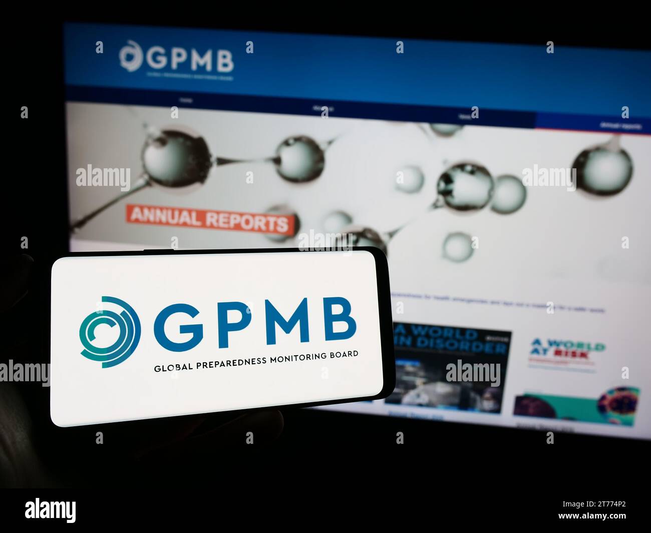 Person holding mobile phone with logo of Global Preparedness Monitoring ...