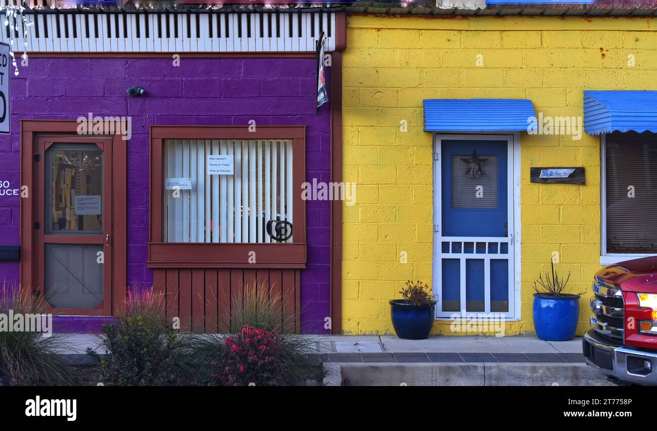 A multi-colored building featuring hues of yellow, purple, and blue ...