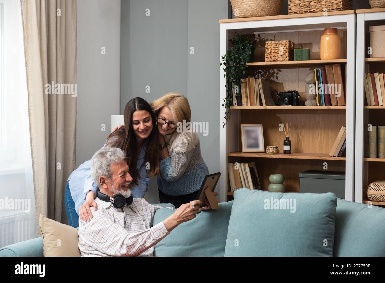Family gathering. Father, Mother and daughter in the family home ...