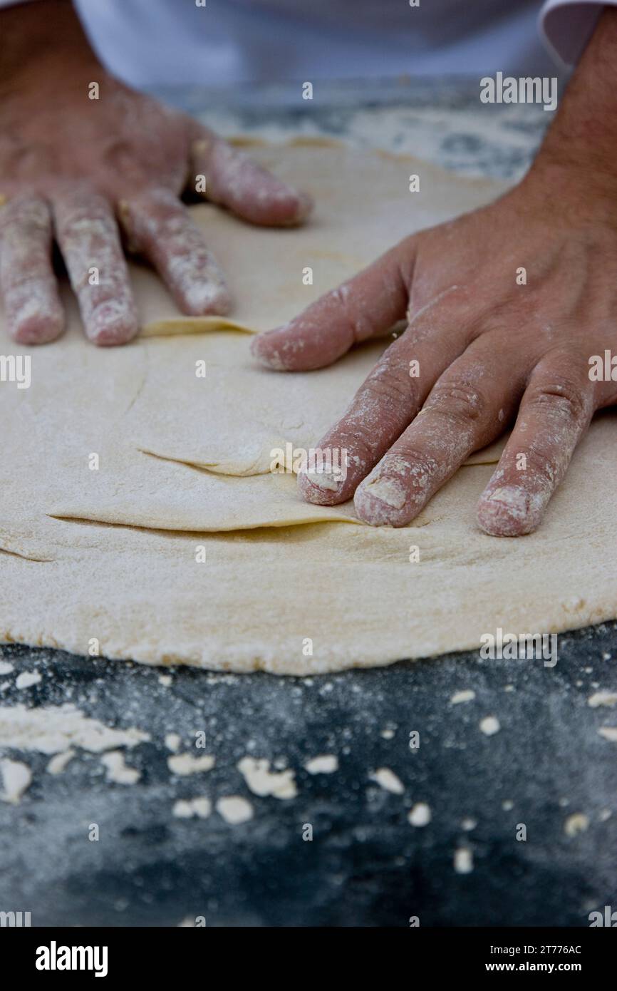 Close up of a chef hands covered in flour kneading a pizza dough Stock ...