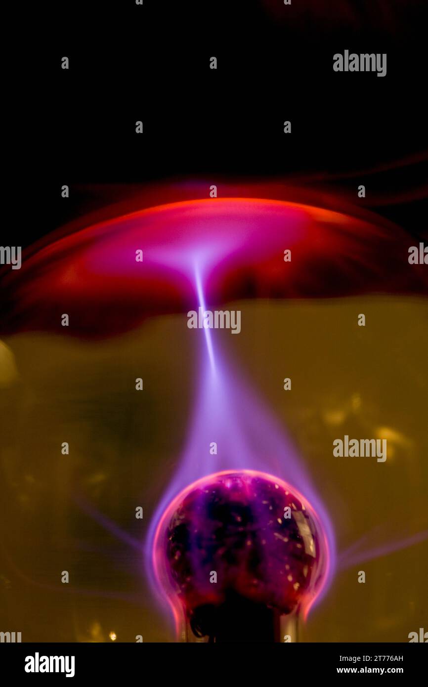 Plasma ball with red purple and pink electrical discharge Stock Photo ...