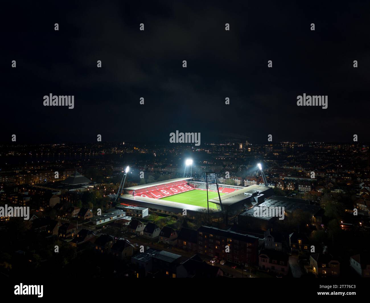 Aerial night view of the illuminated Aalborg stadion (also known as ...