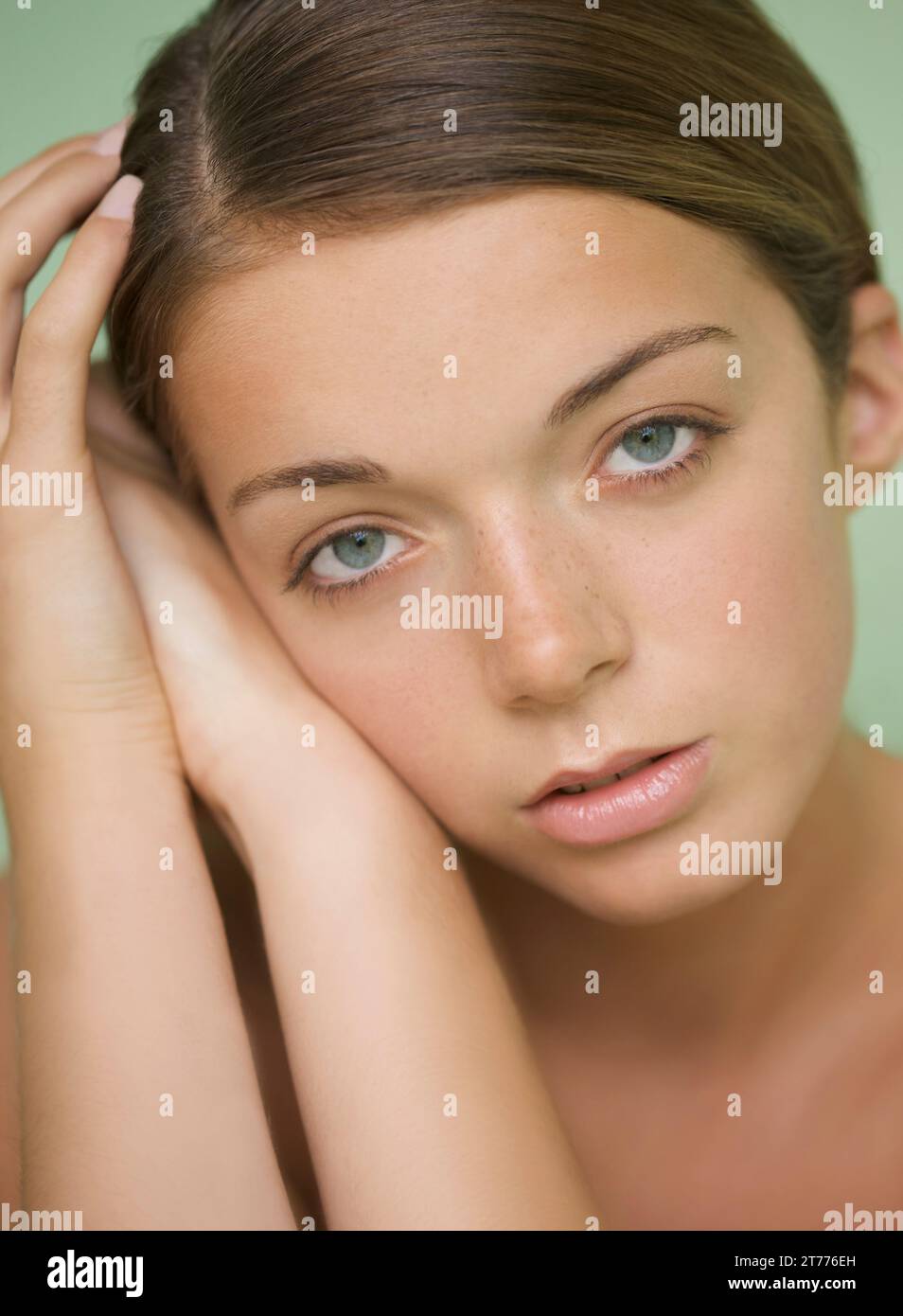 Woman resting head on arms hi-res stock photography and images - Alamy