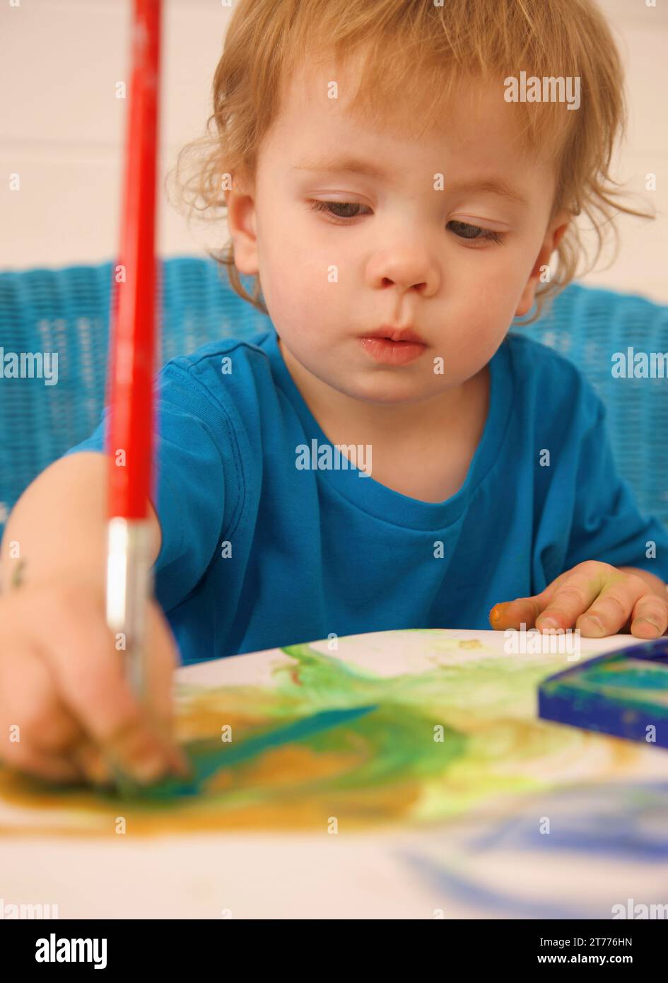 Young boy painting with watercolors Stock Photo - Alamy