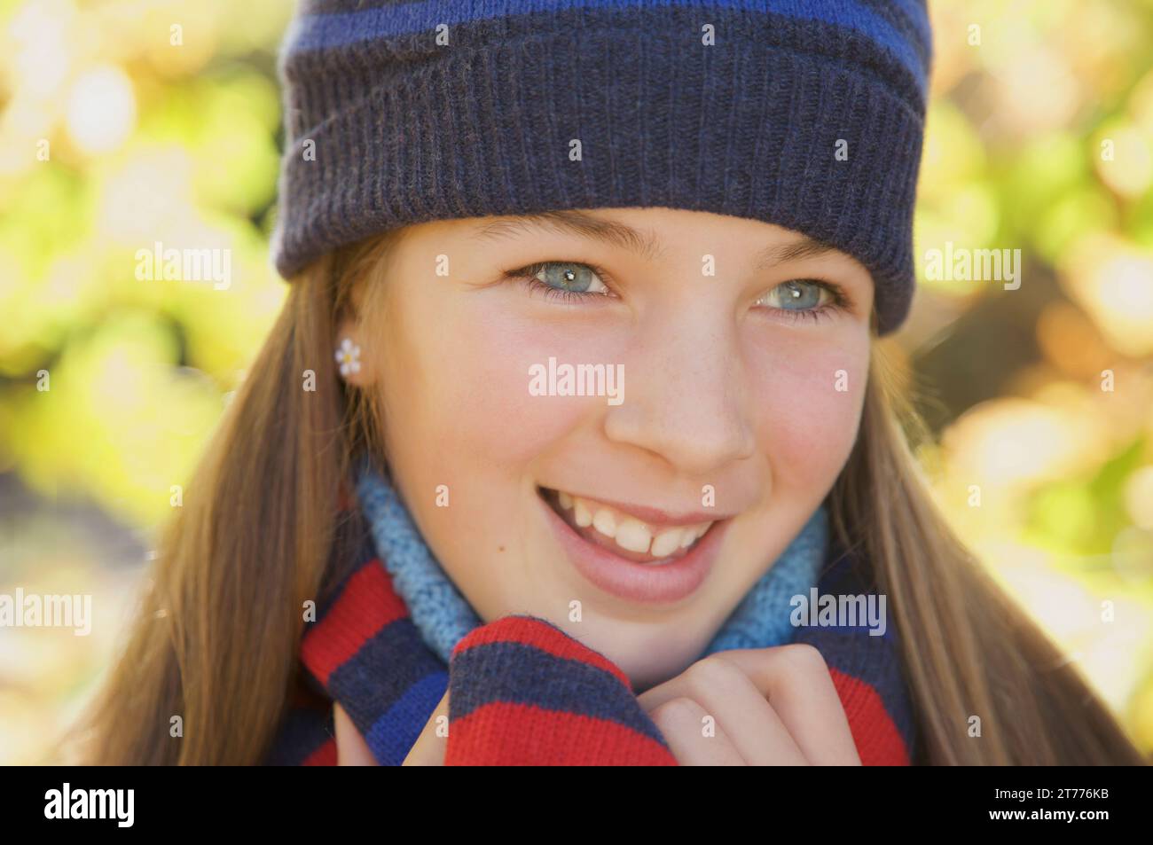 Attractive girl smiling outdoors wearing a hat hi-res stock photography ...