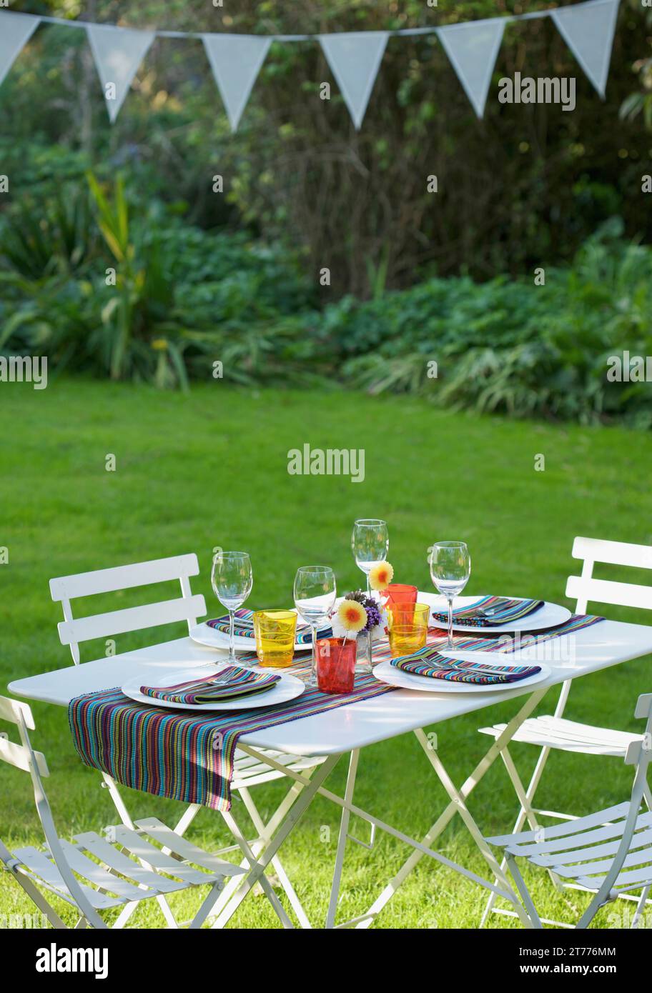 Table laid for lunch in the garden Stock Photo - Alamy