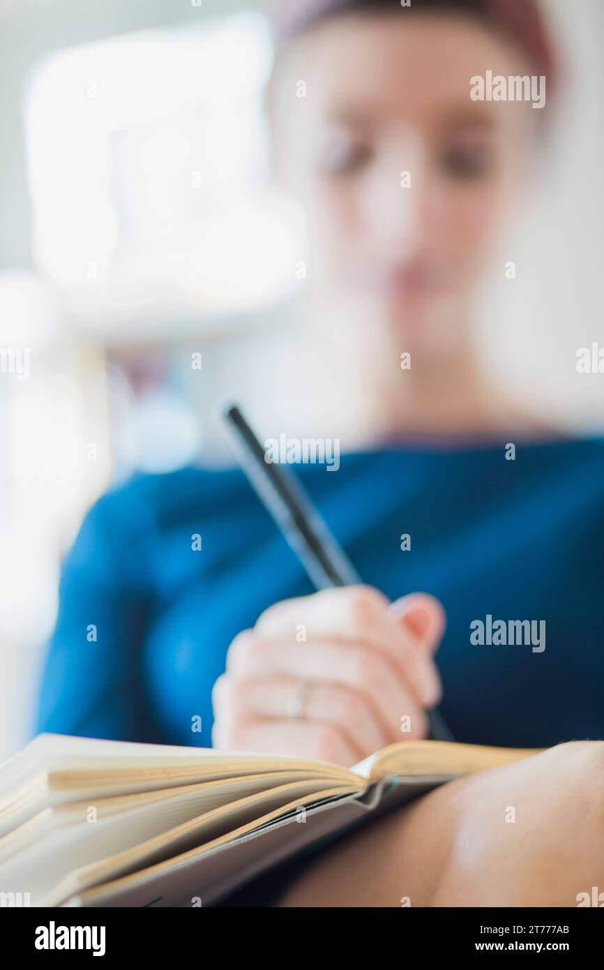 Woman writing on calendar hi-res stock photography and images - Alamy