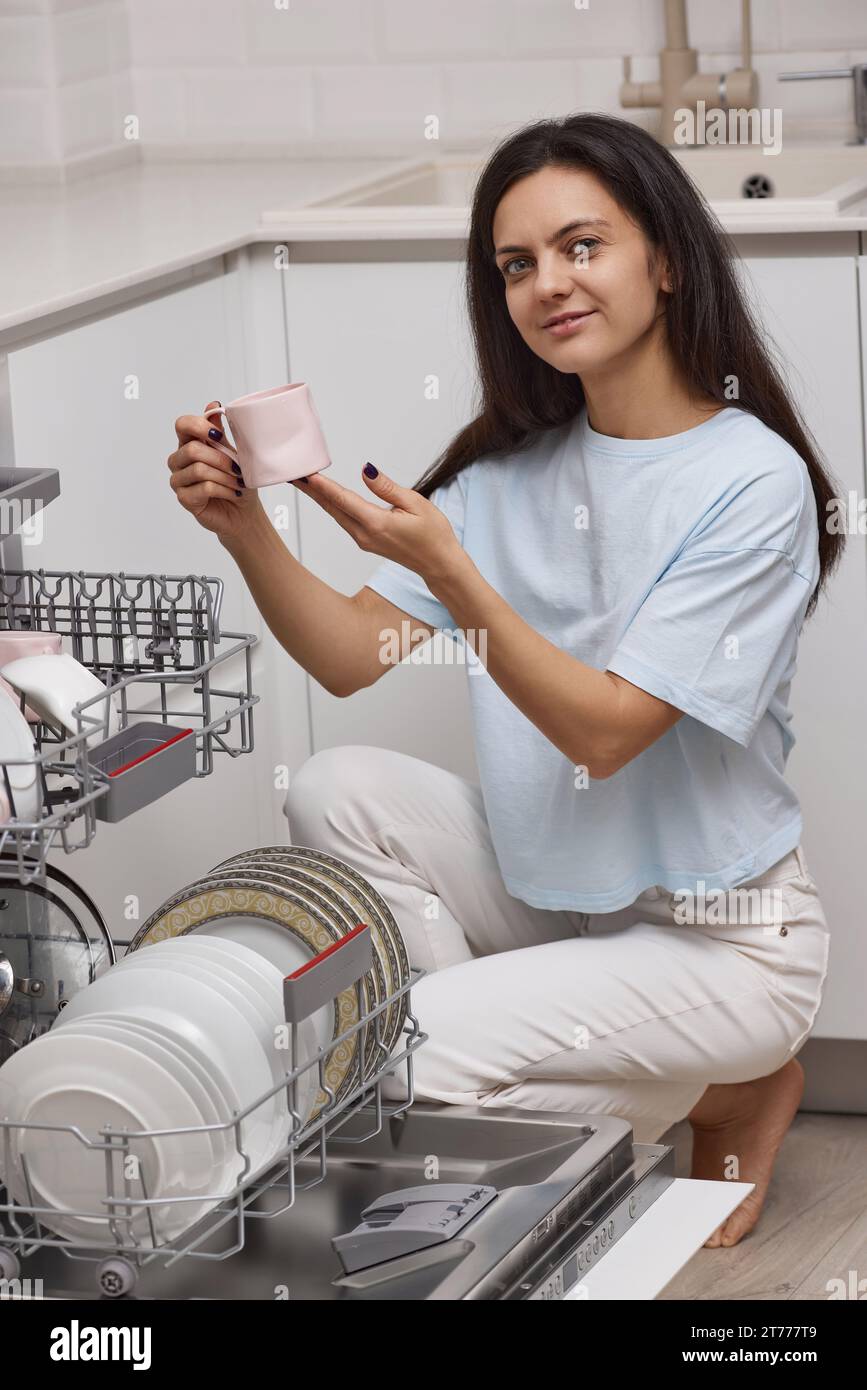 Woman sitting inside washing machine hi-res stock photography and ...