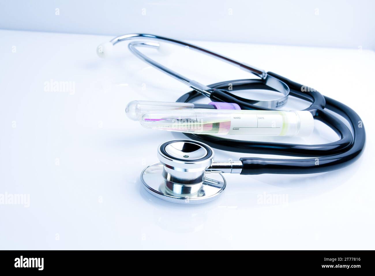 chemical test tube near stethoscope with blue tint on the table Stock ...
