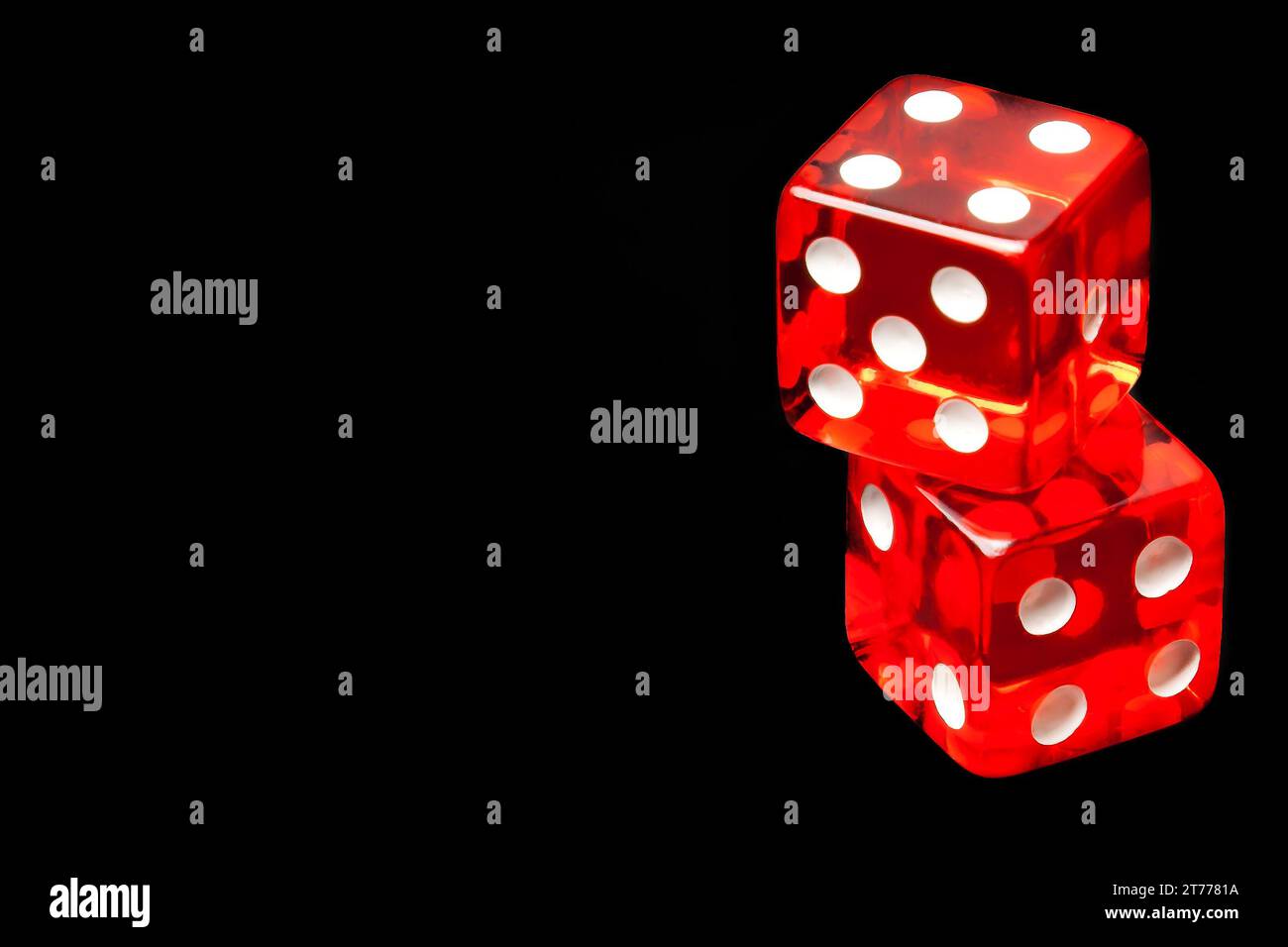 two red dice on black background with space for text Stock Photo - Alamy
