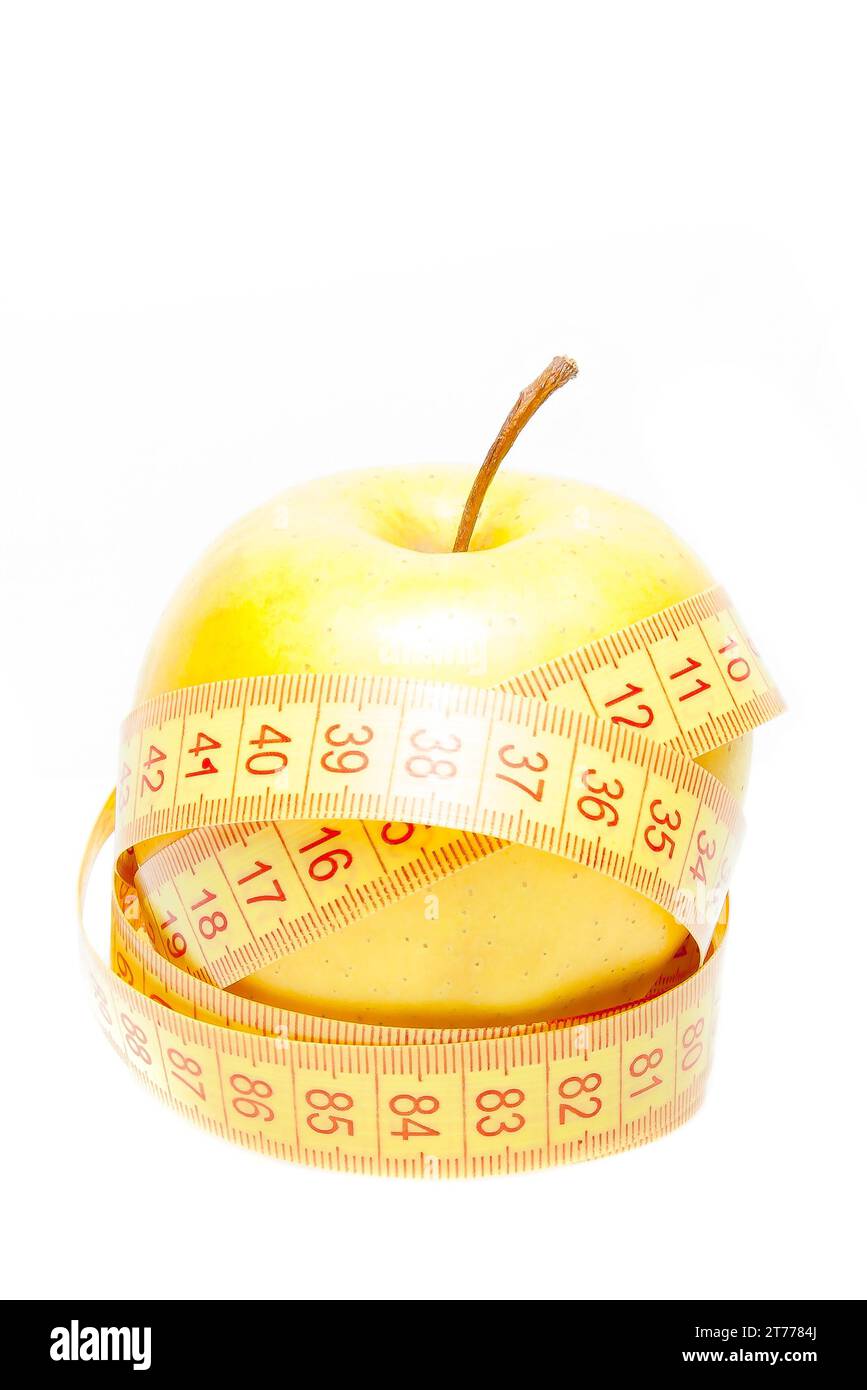 an apple with tape measure on white background Stock Photo - Alamy