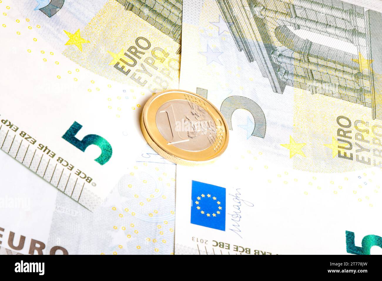 top of view of one euro coin on new five euro banknotes Stock Photo - Alamy