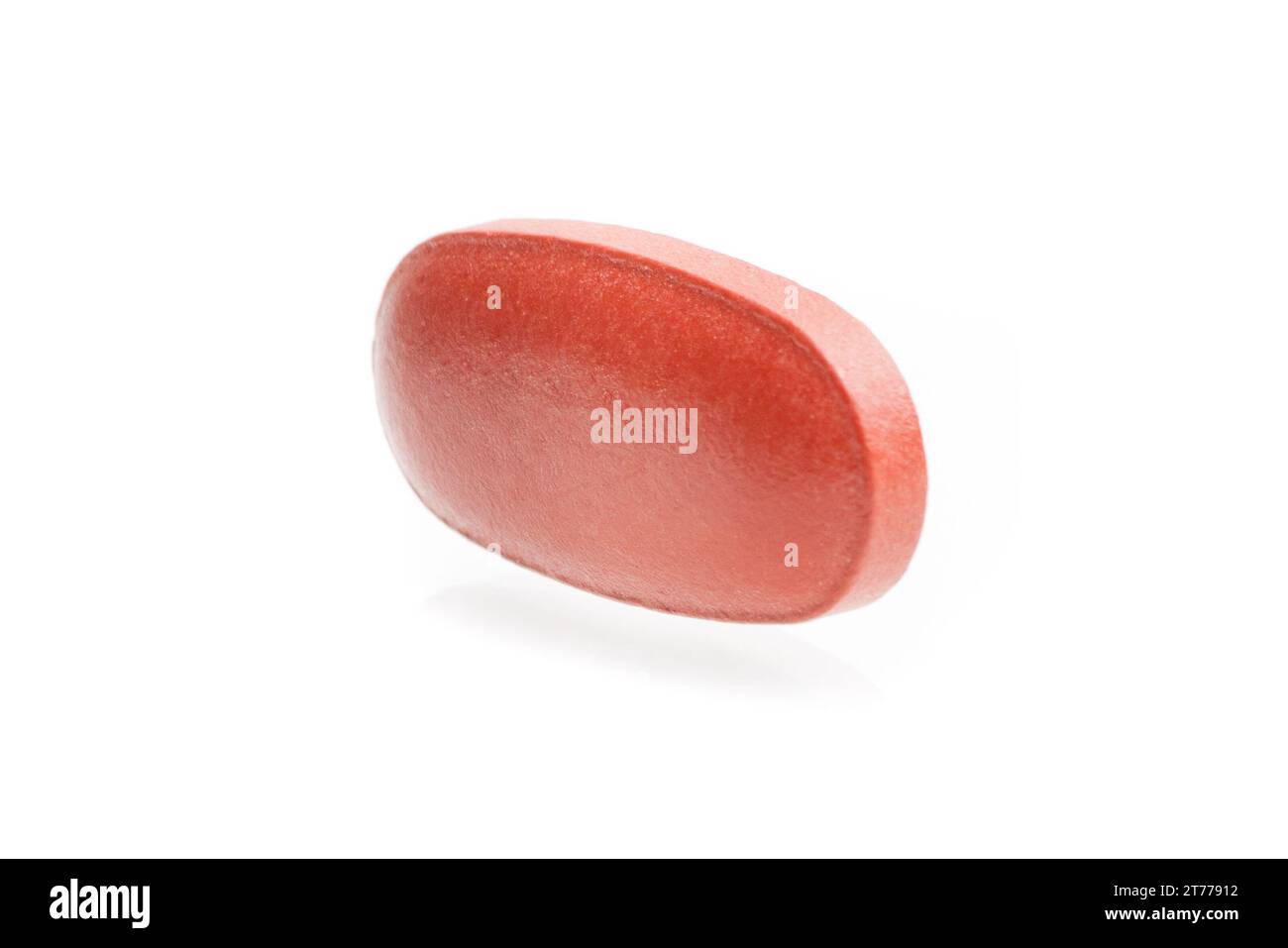 red medical pill isolated on white background Stock Photo - Alamy