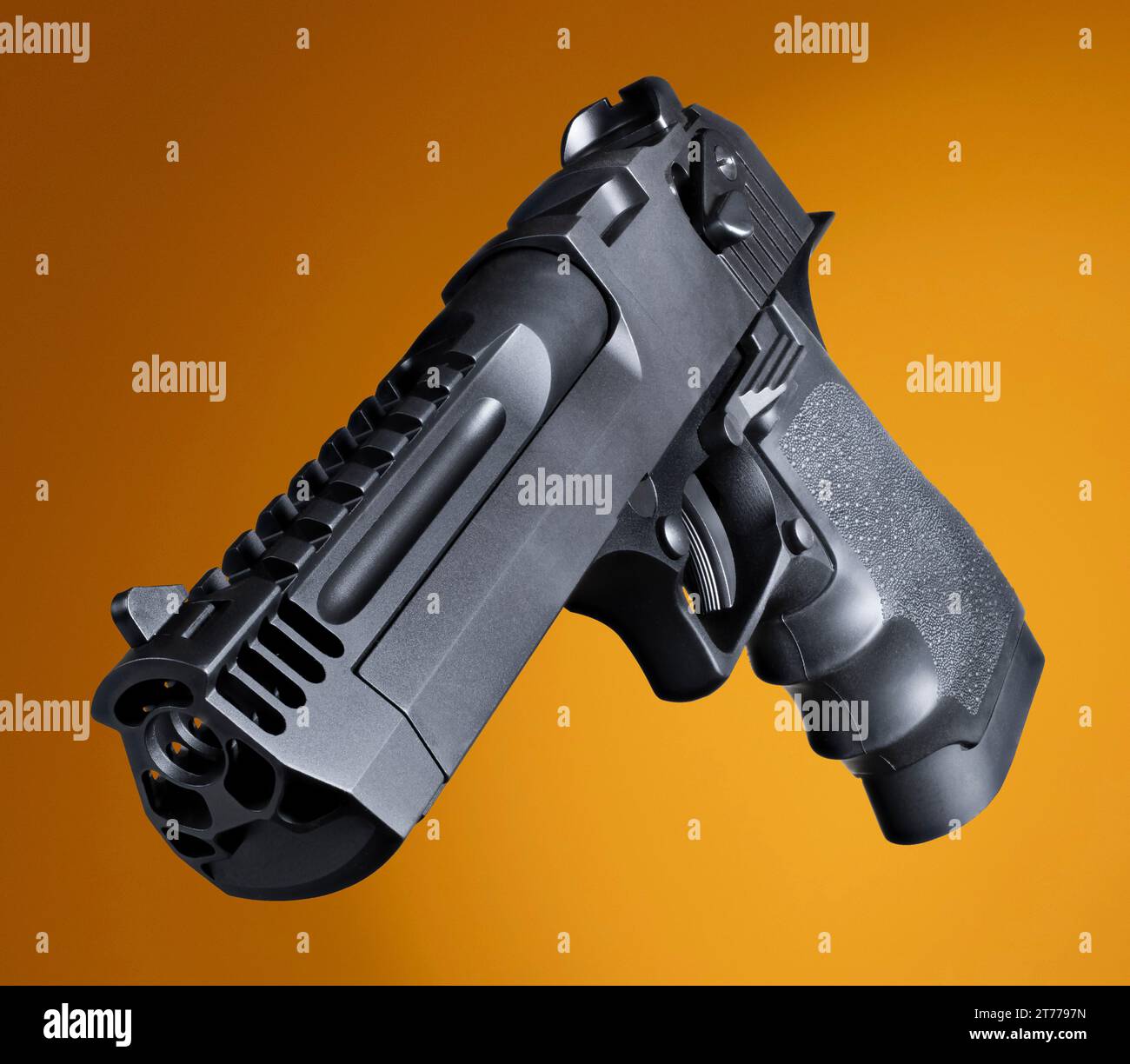 Semi-automatic pistol angled toward viewer on an orange background ...