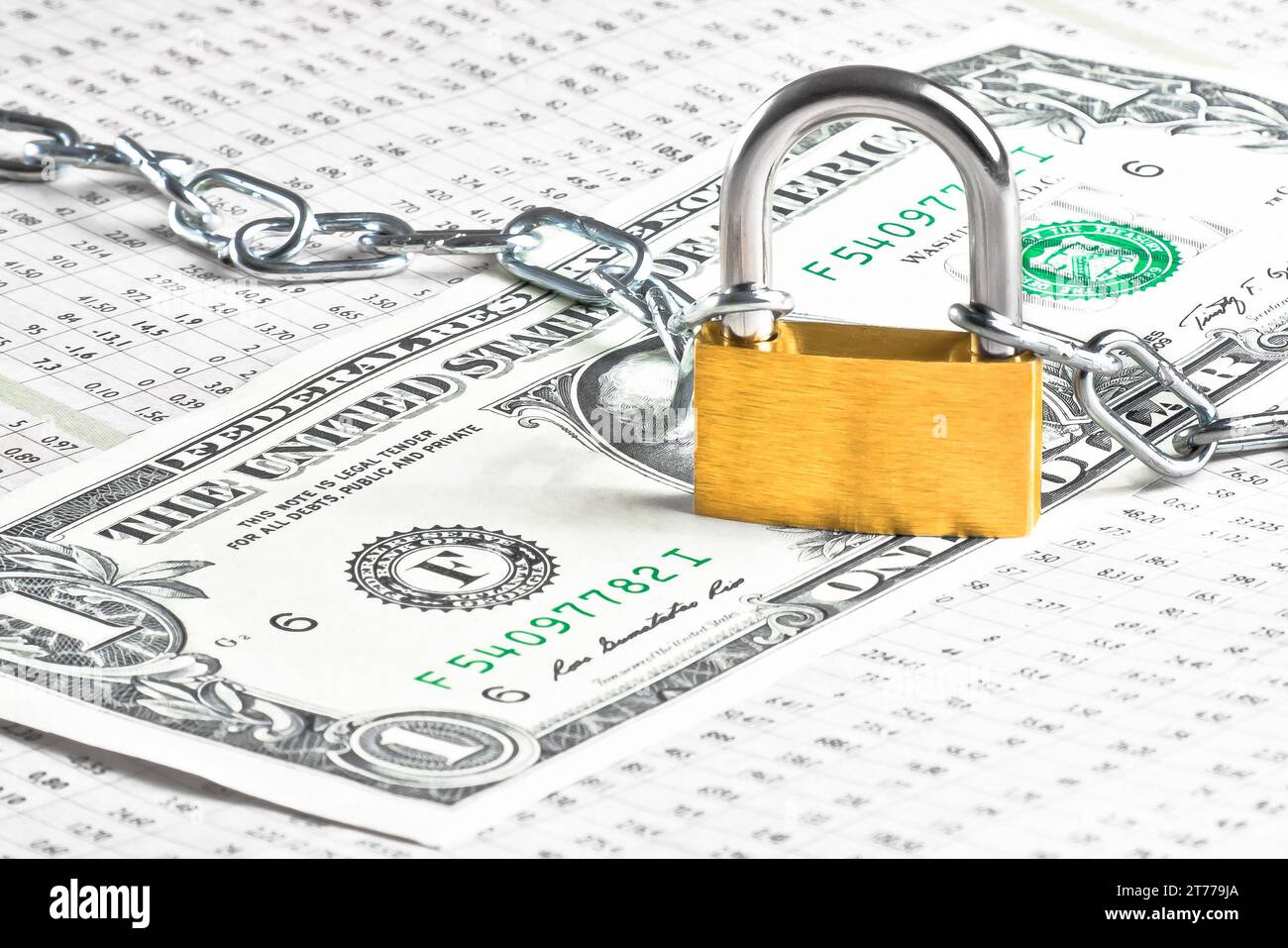 lock security and chain on dollar banknote on financial newspaper ...