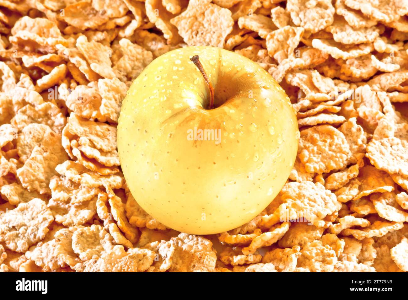 yellow apple on corn flakes background, diet concept Stock Photo - Alamy