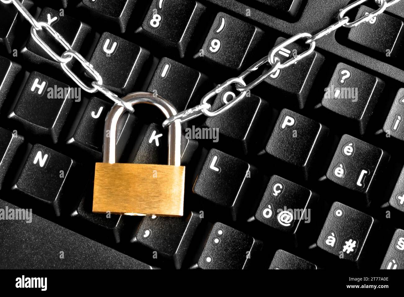 Detail Of A Lock Security With Chain On Black Keyboard Computer