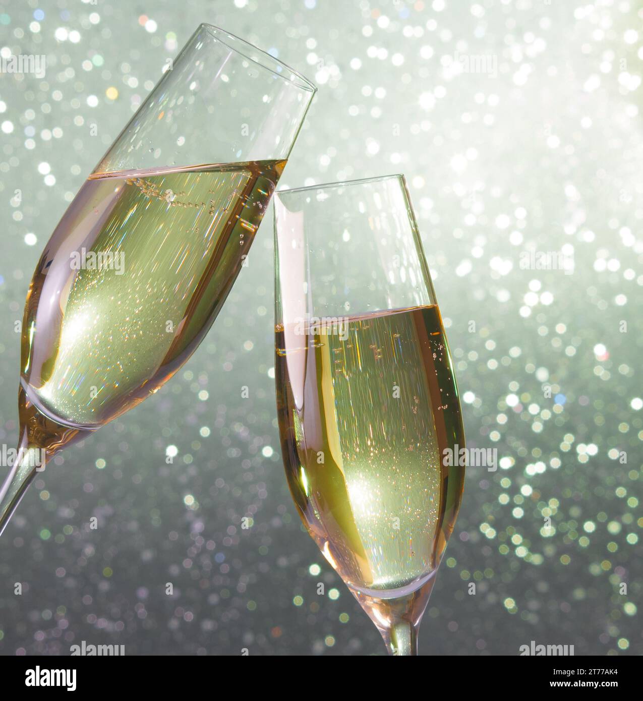 champagne flutes make cheers on silver light bokeh background Stock ...