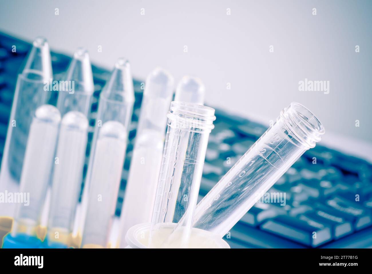 test tubes in laboratory near keyboard on table Stock Photo - Alamy