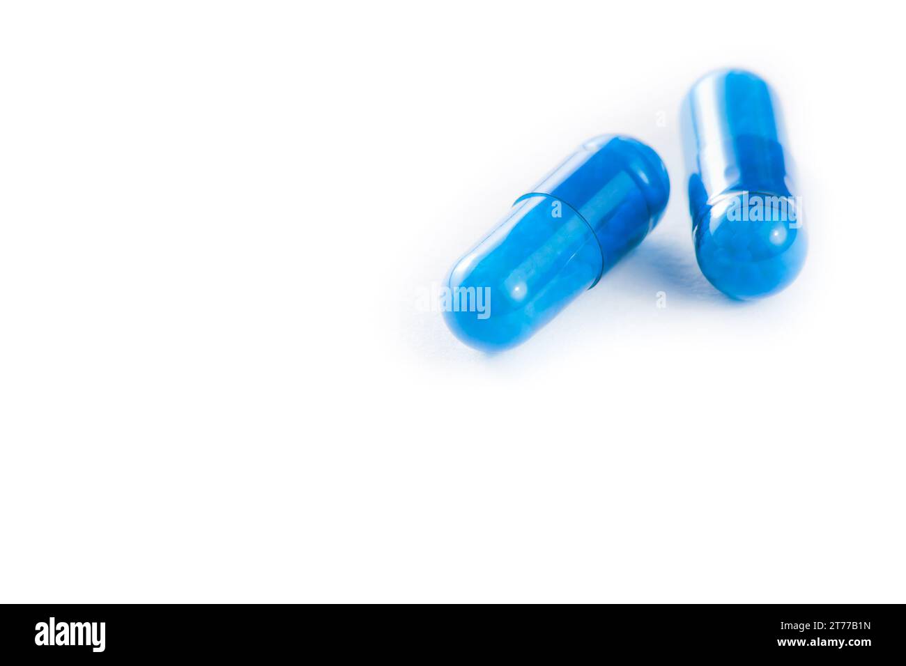 two blue pills isolated on white background with space for text Stock ...