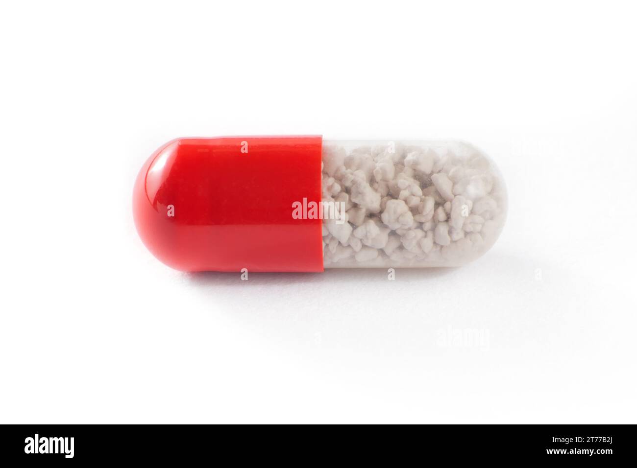 red pill isolated on white background Stock Photo - Alamy