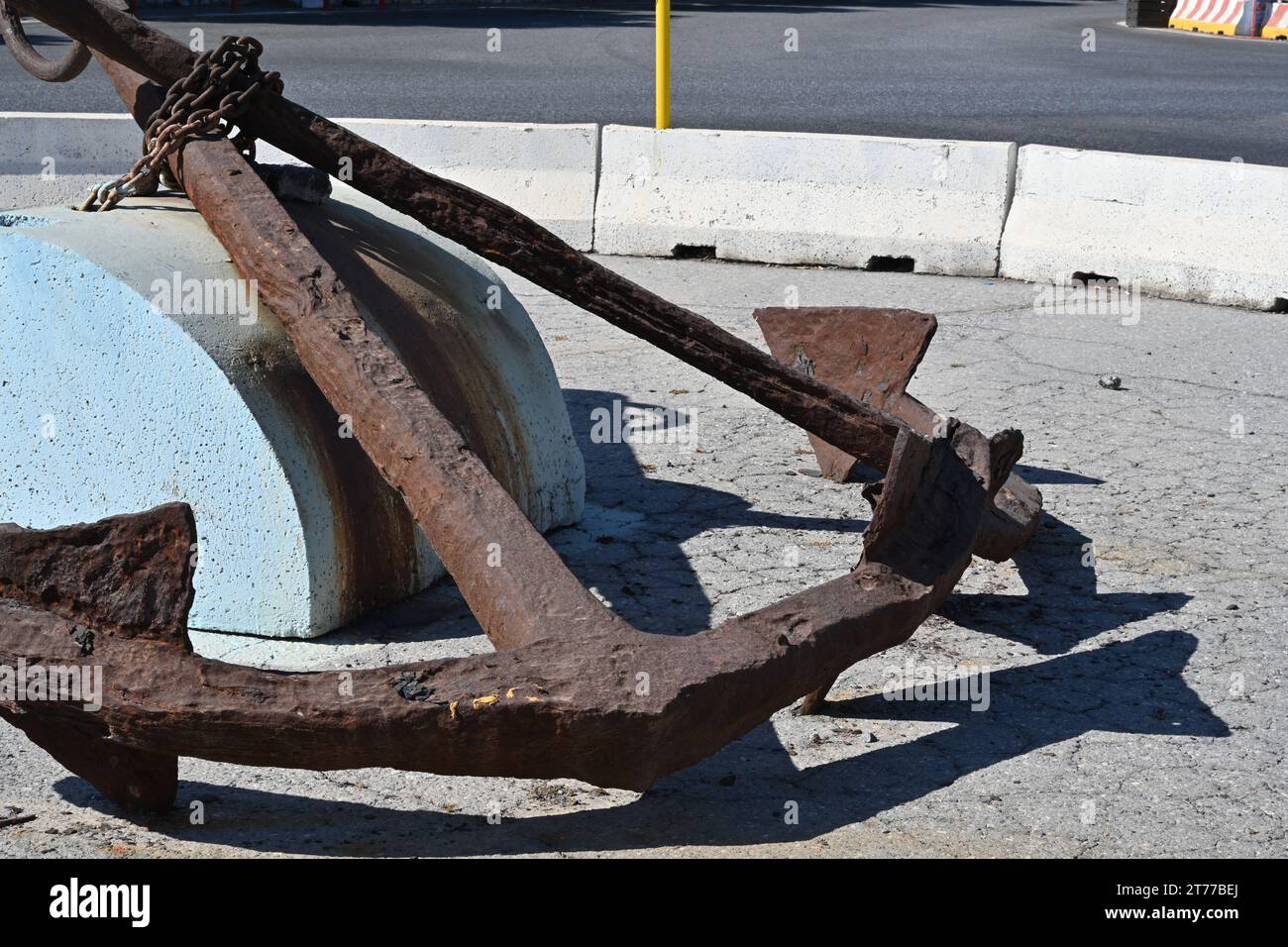 View on two old rusty anchors with chain placed in the middle of ...