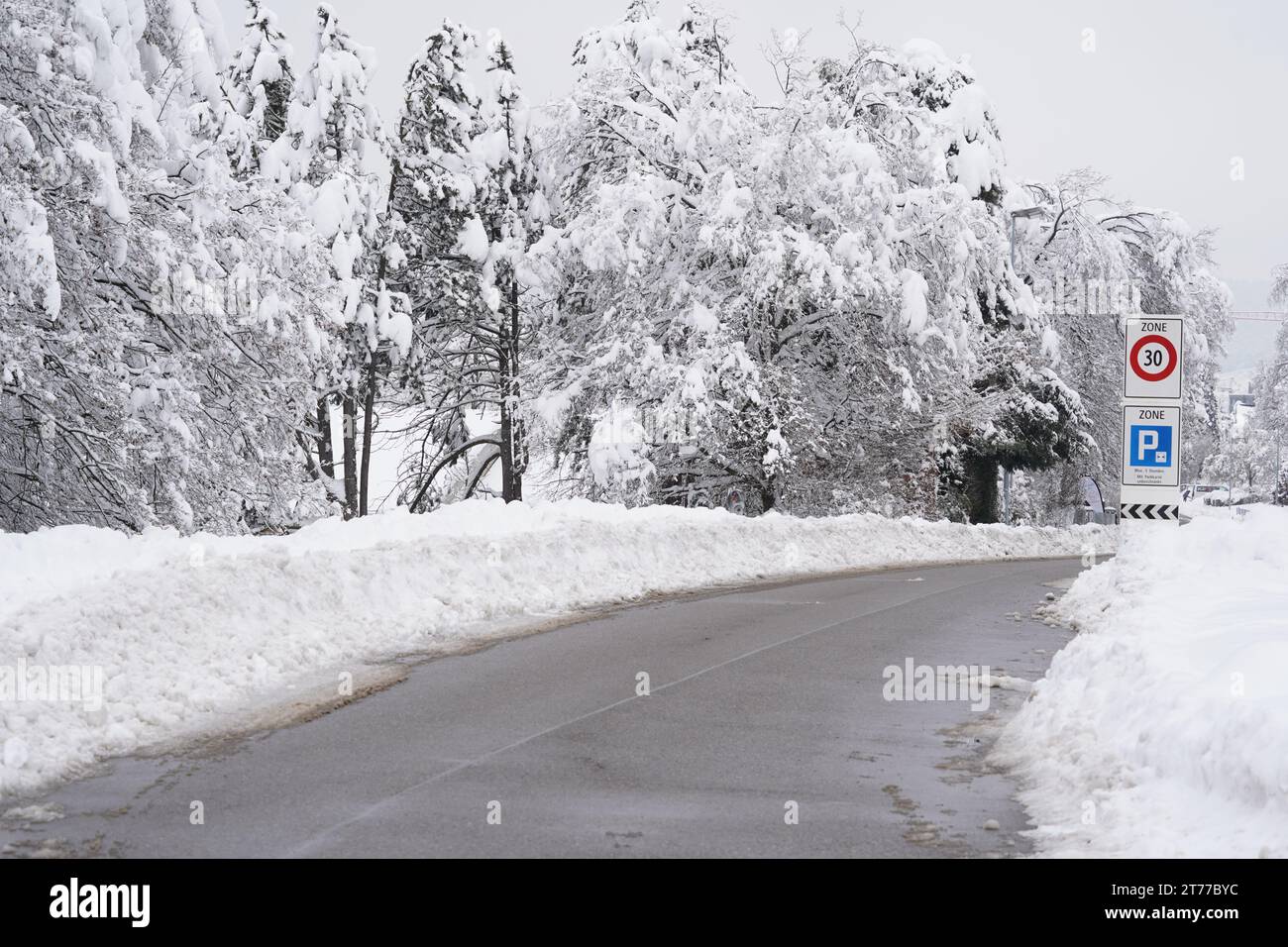 Traffic signs marking begin of residential district, begin of reduced ...