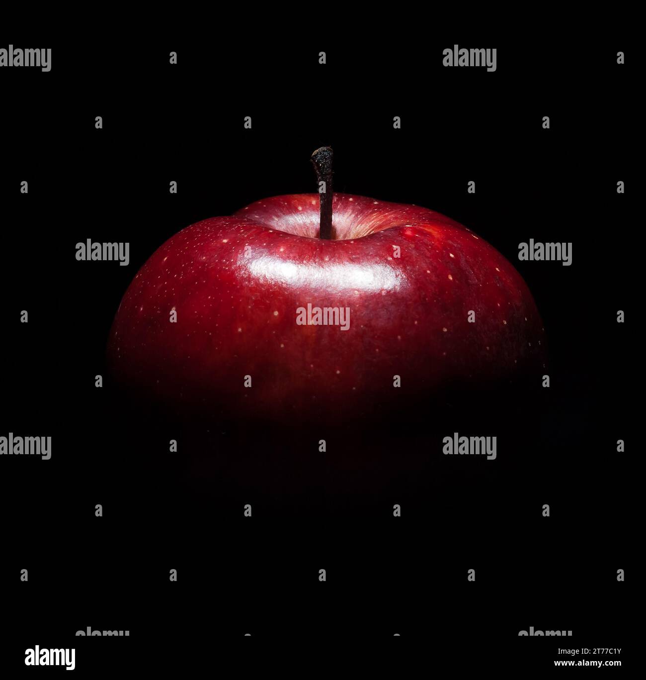 fresh red apple against black background with space for text Stock ...