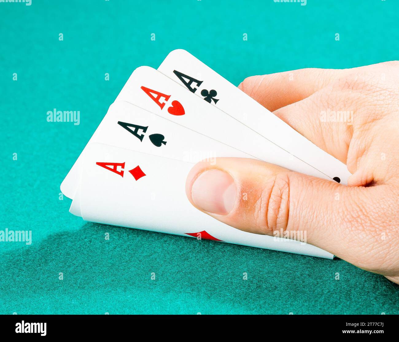 playing cards in a man hand on gaming table Stock Photo - Alamy