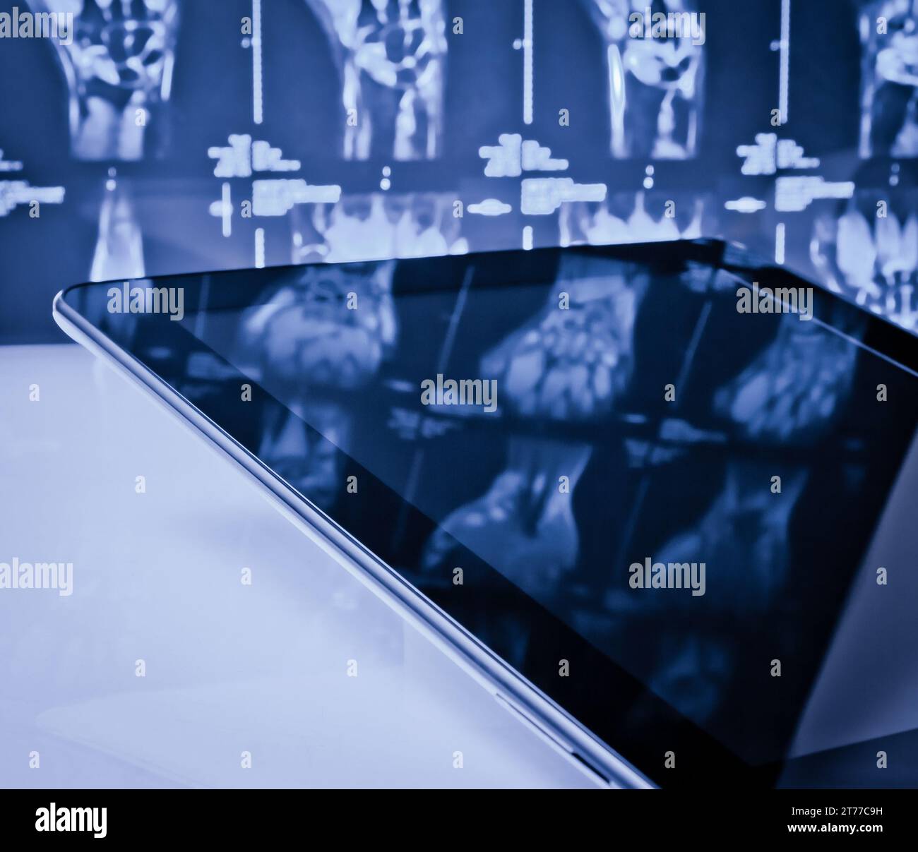 modern digital tablet pc in laboratory on x-ray images background ...