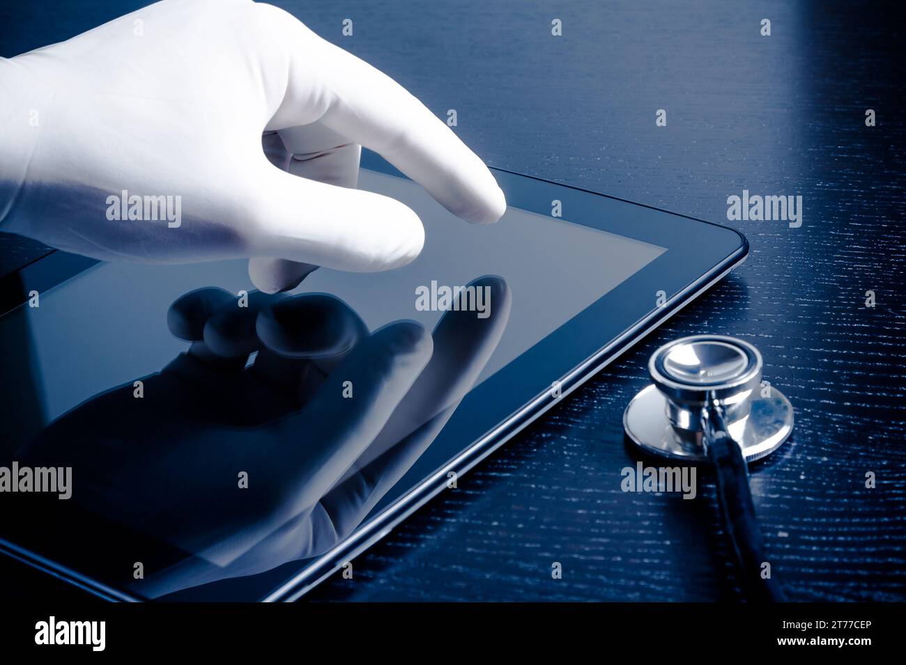 hand in medical glove touching modern digital tablet pc near ...
