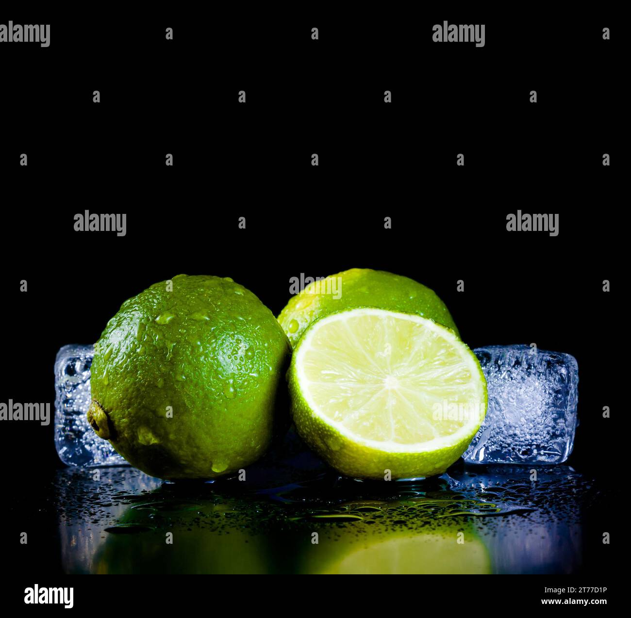 fresh lime with ice cubes on black background with space for text Stock ...