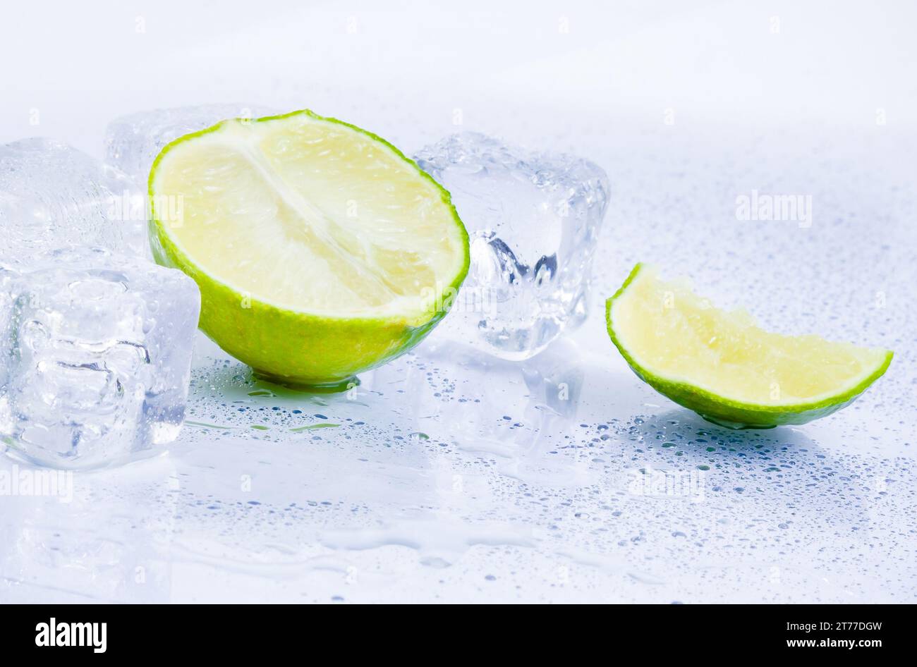 Ice cubes with fresh lime isolated on white background Stock Photo - Alamy