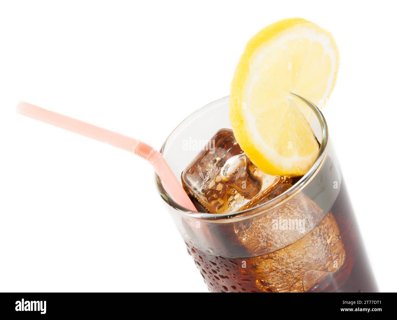 glass of fresh coke with straw with lemon slice on top and white ...