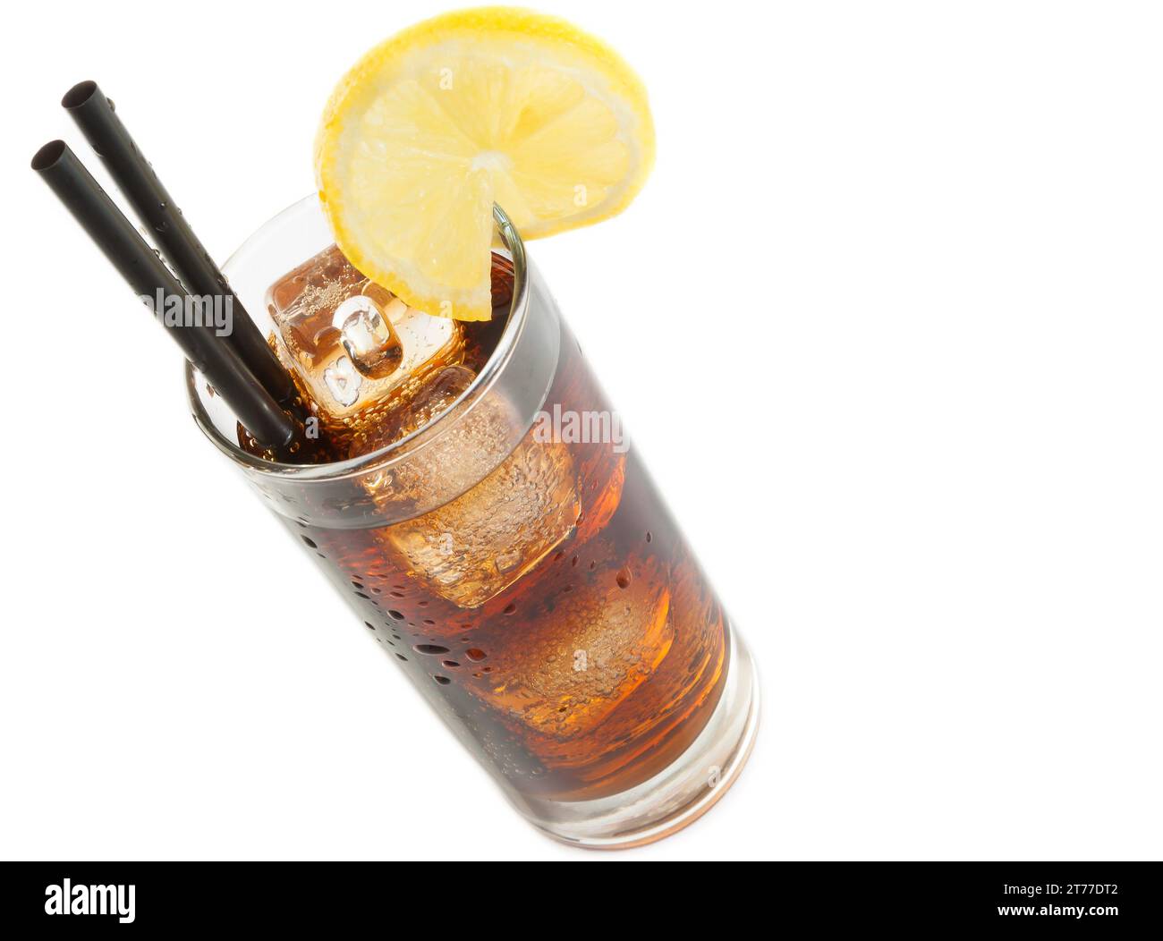 fresh coke with straw with lemon slice on top and white background with ...