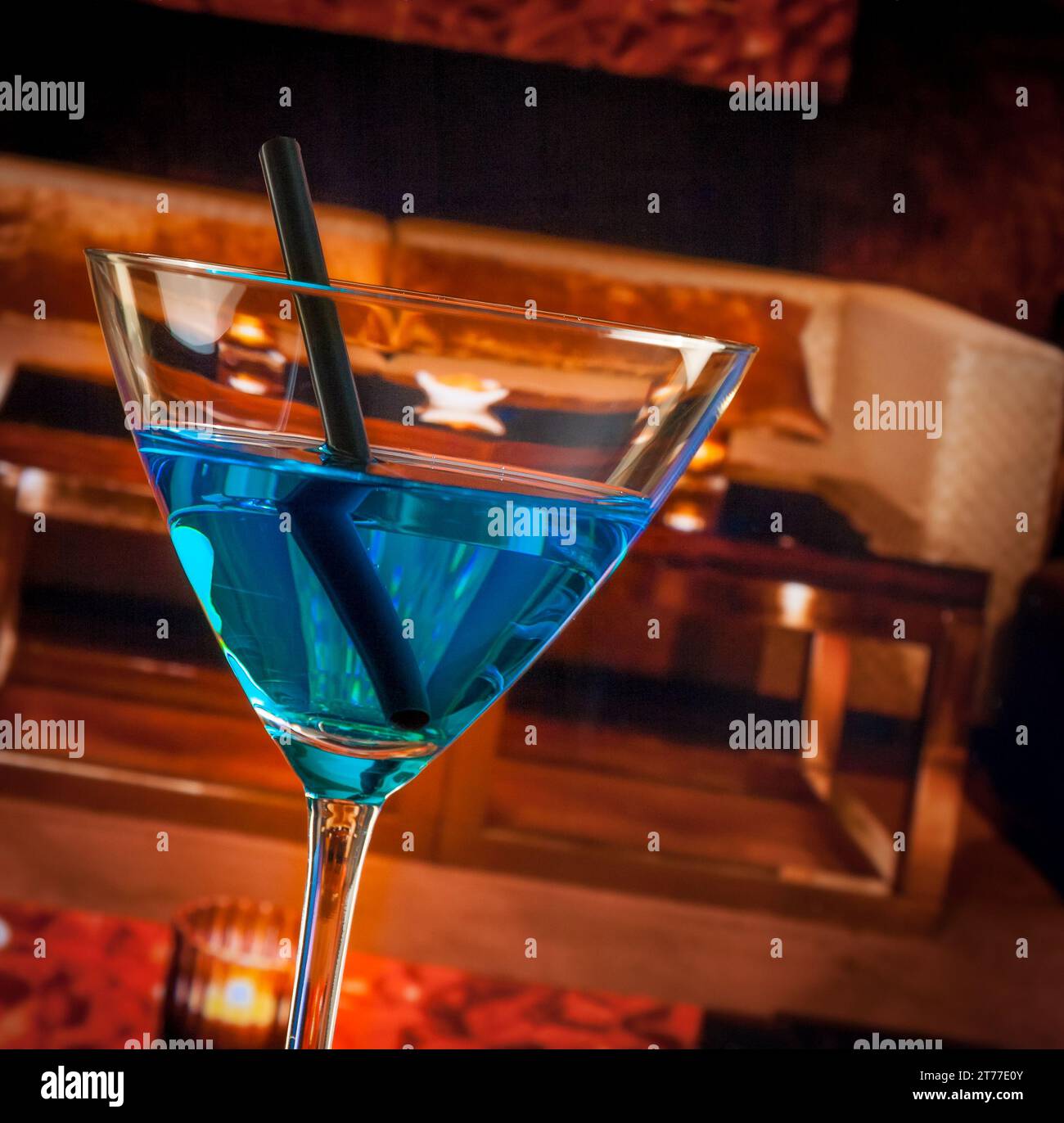 detail of blue cocktail drink on a lounge bar table, club atmosphere ...