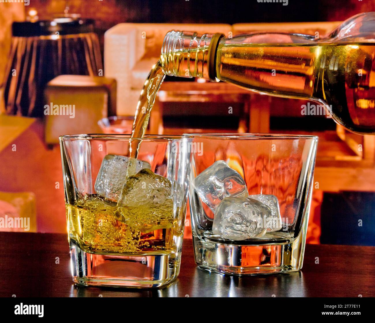 barman pouring whiskey in a lounge bar on wood table Stock Photo - Alamy