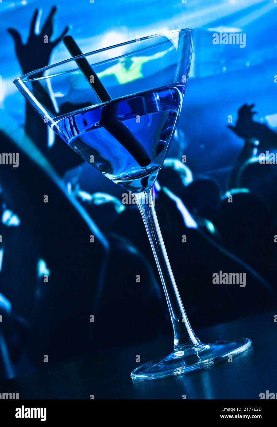 blue cocktail drink on a disco table, disco atmosphere Stock Photo - Alamy