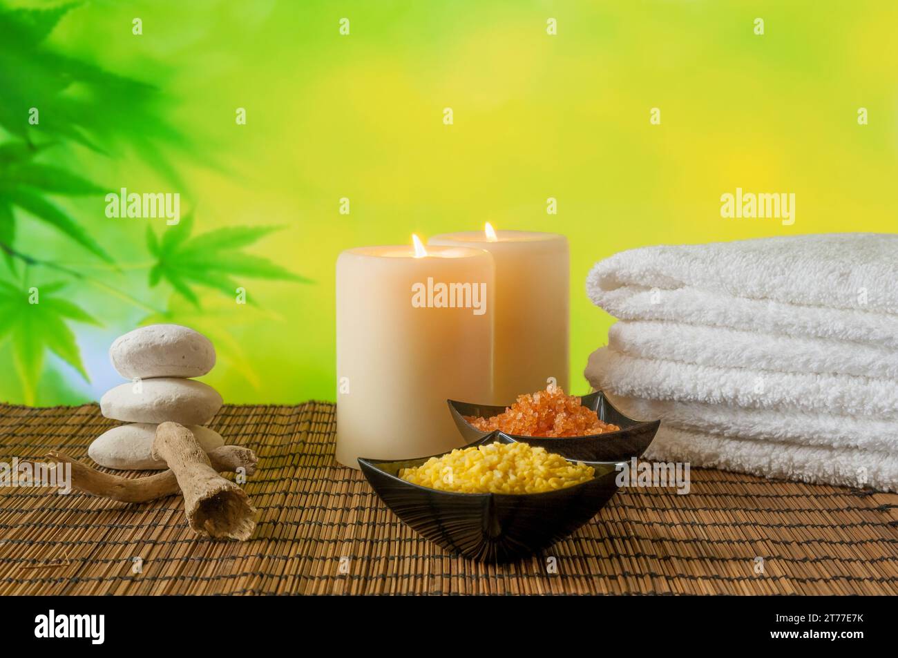 Spa massage border background with towel stacked, candle and sea salt ...