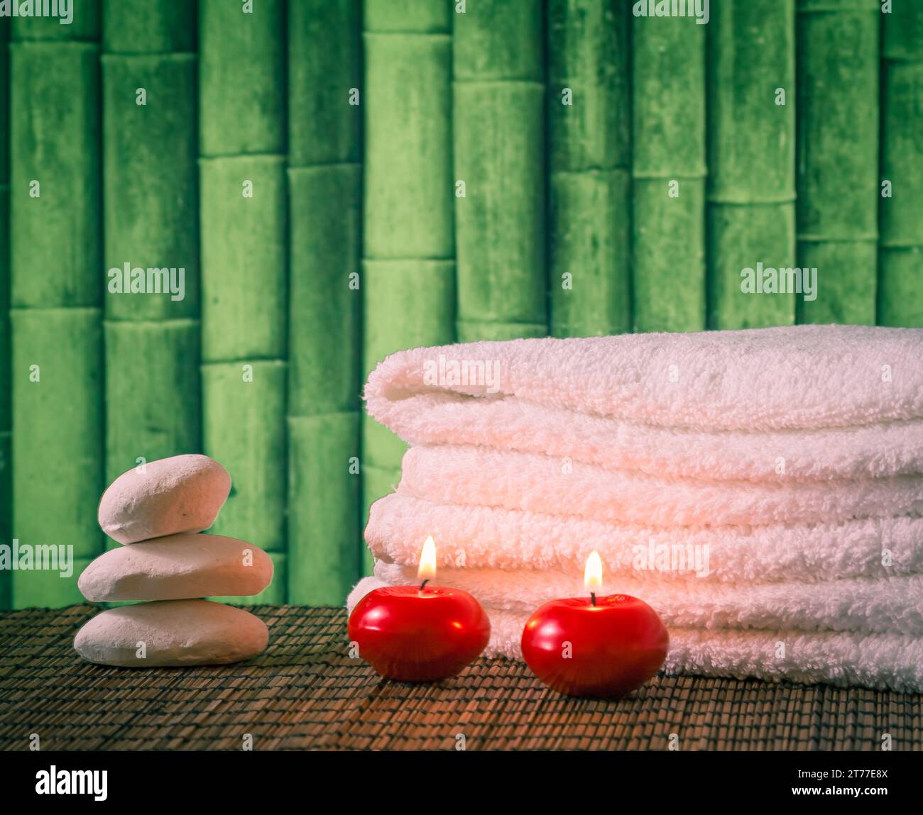 Spa massage border background with towel stacked candles on bamboo ...
