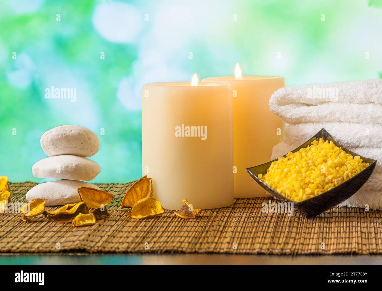 Spa massage border background with towel stacked, candles and sea salt ...