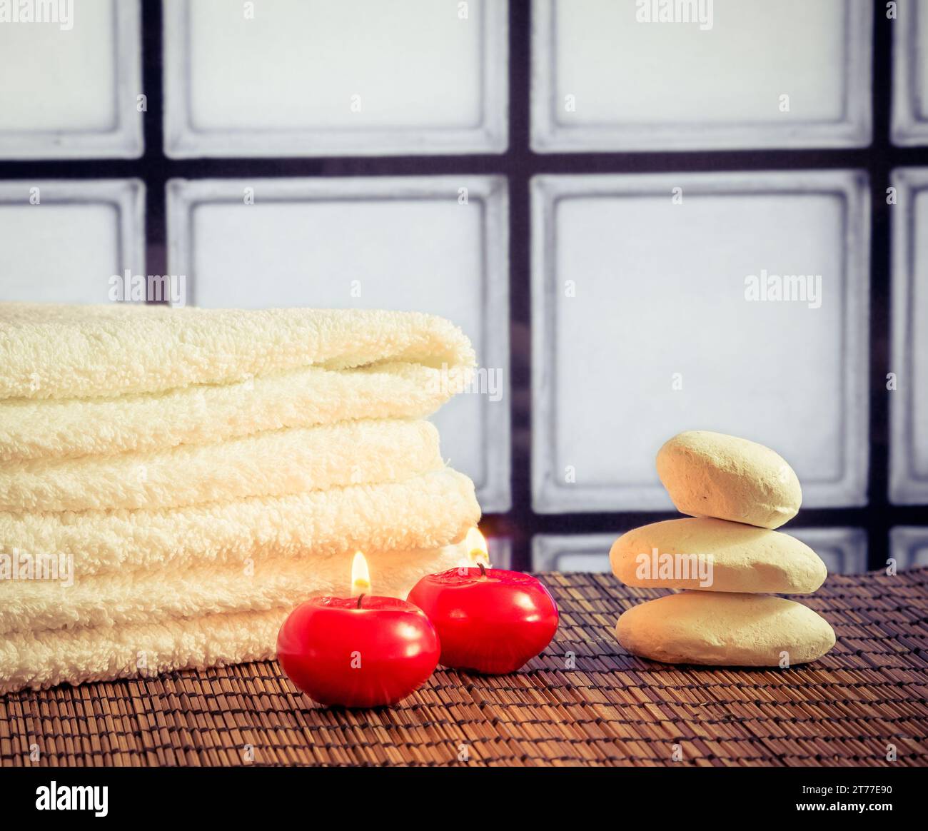 Spa massage border background with towel stacked stone and red candles ...
