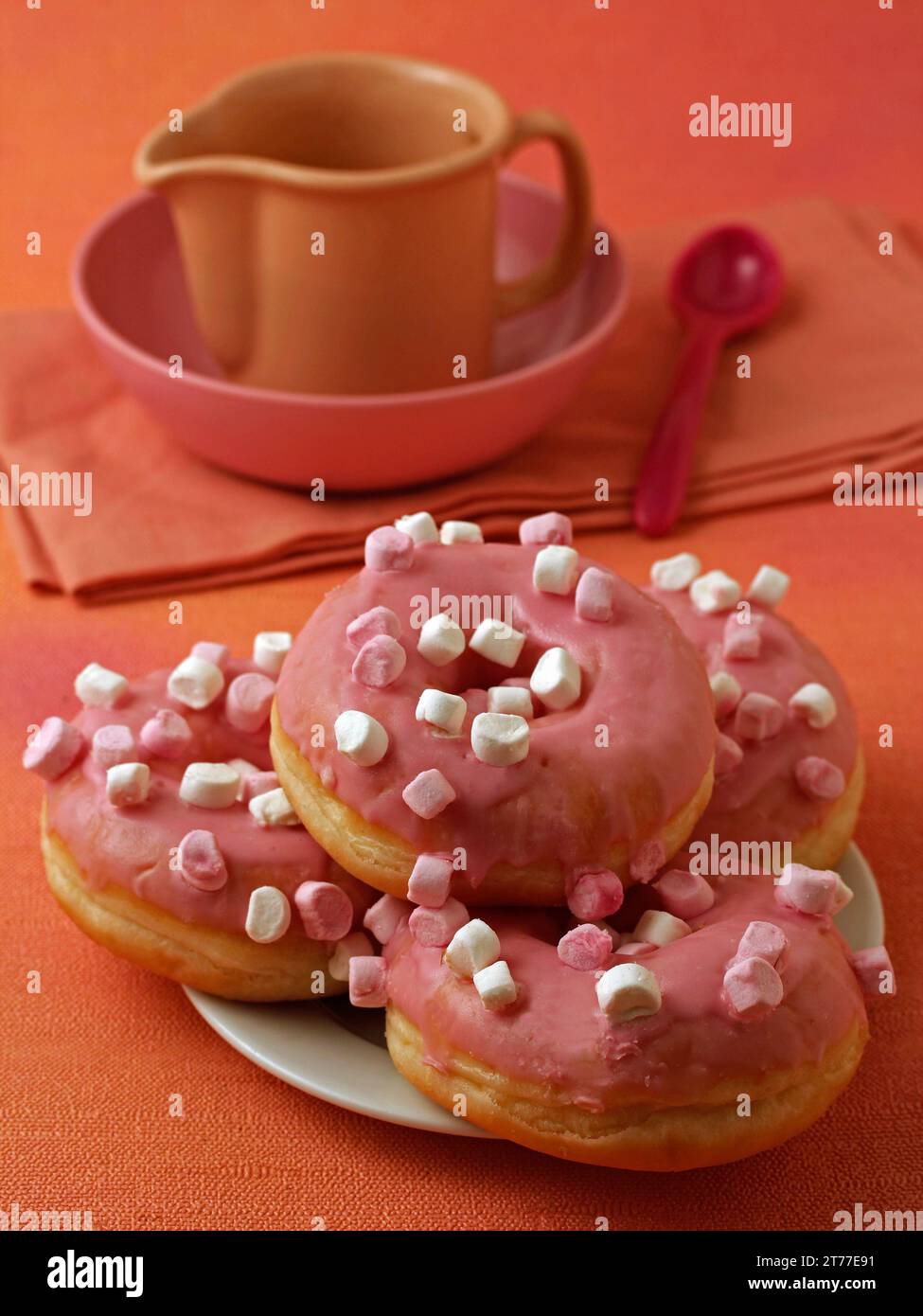 Pink donuts with marshmallows. Barbie color trend Stock Photo - Alamy