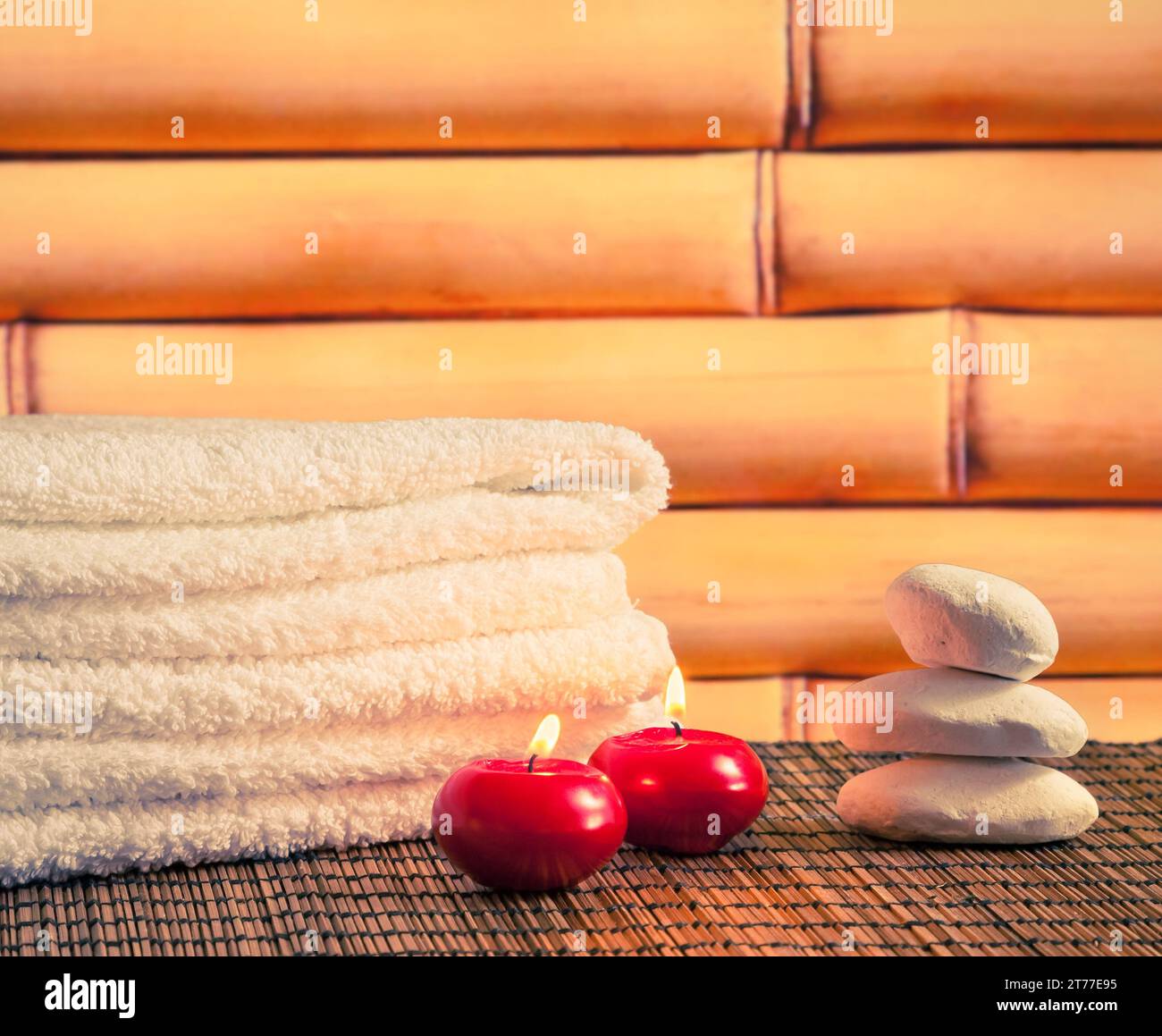 Spa massage border background with towel stacked stone and red candles ...