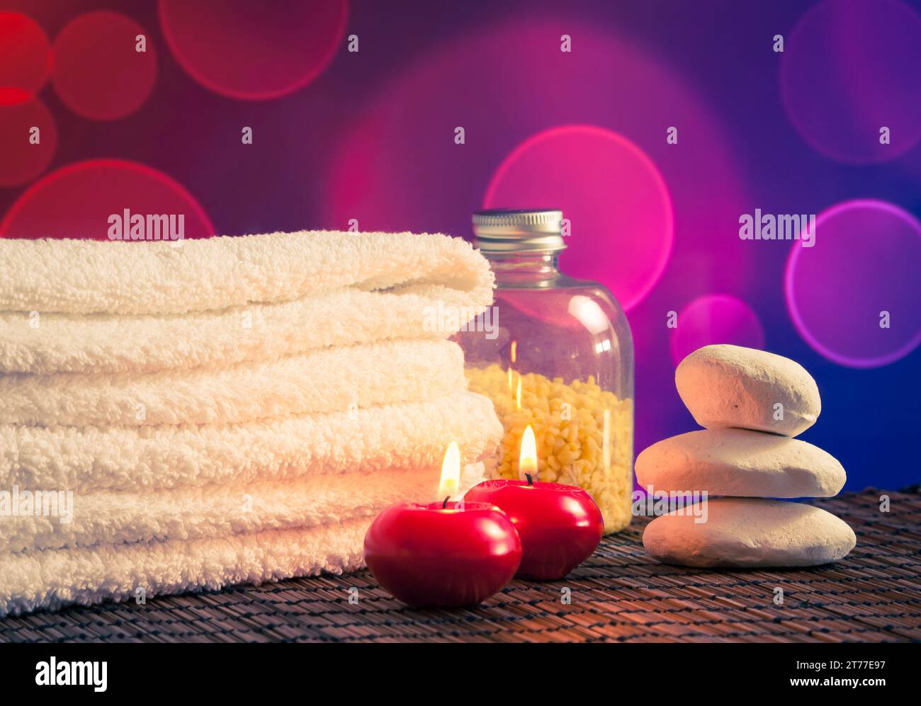 Spa massage border background with towel stacked,red candles and stone ...