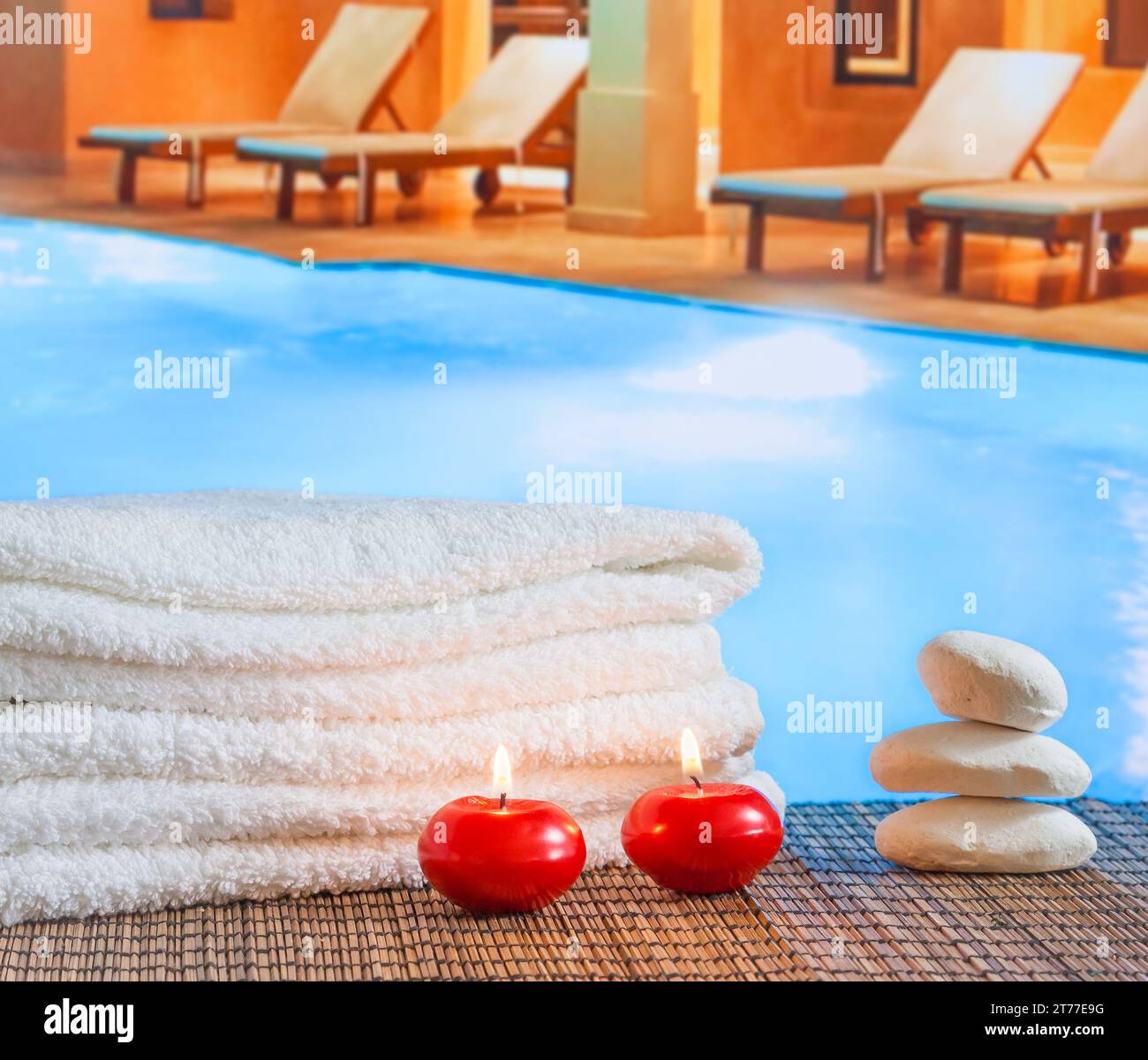 Spa massage border background with towel stacked,red candles and stone ...