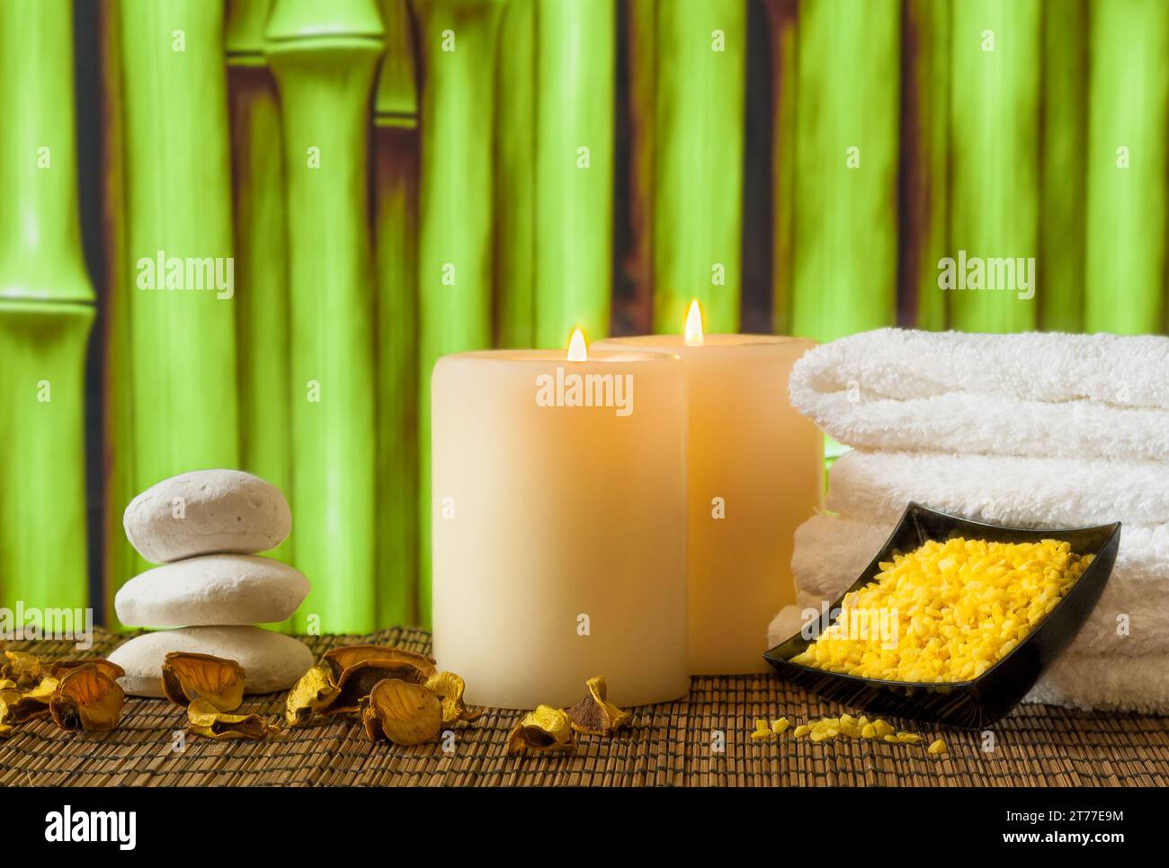 Spa massage border background with towel stacked, candles and sea salt ...