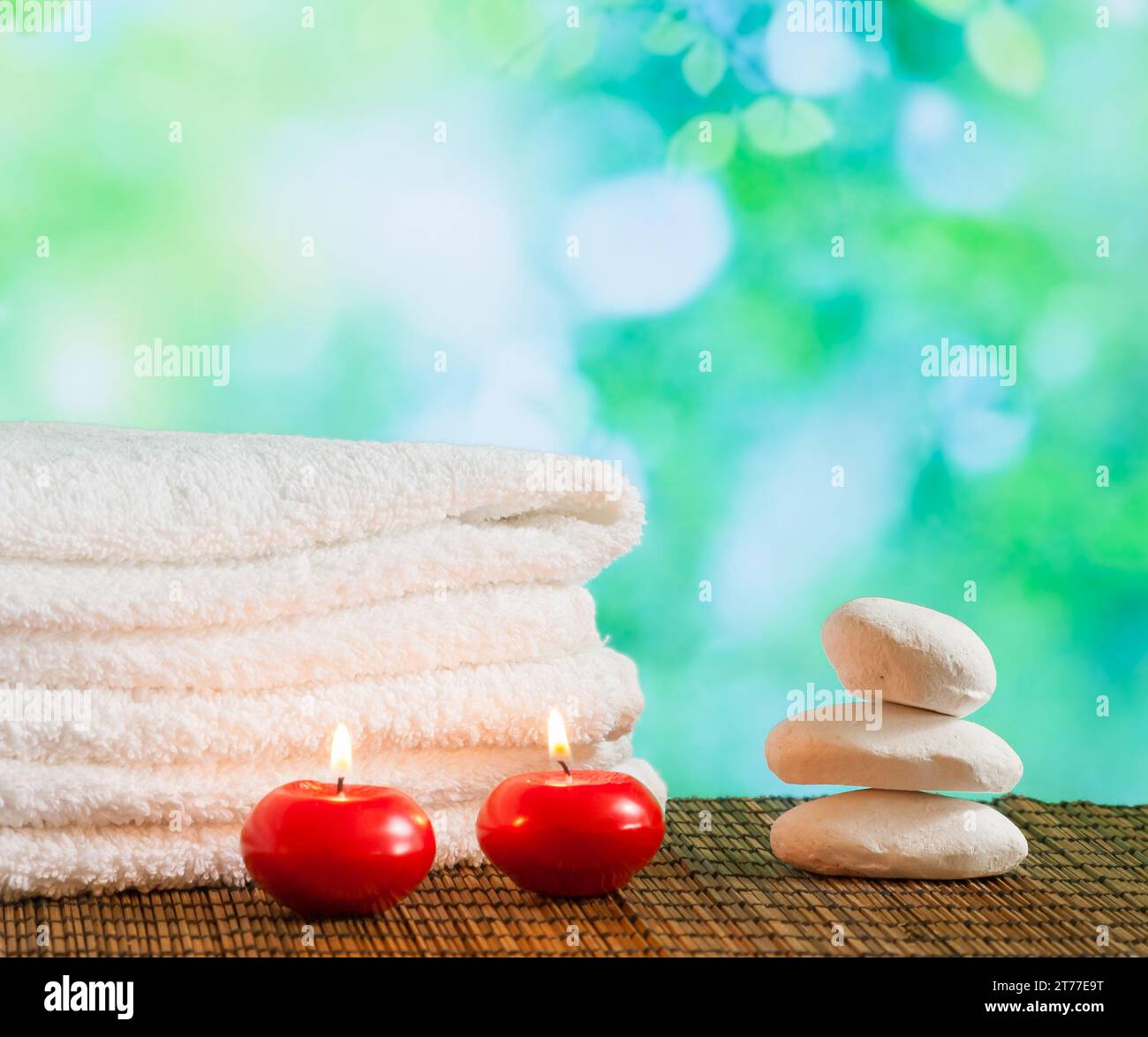 Spa massage border background with towel stacked,red candles and stone ...