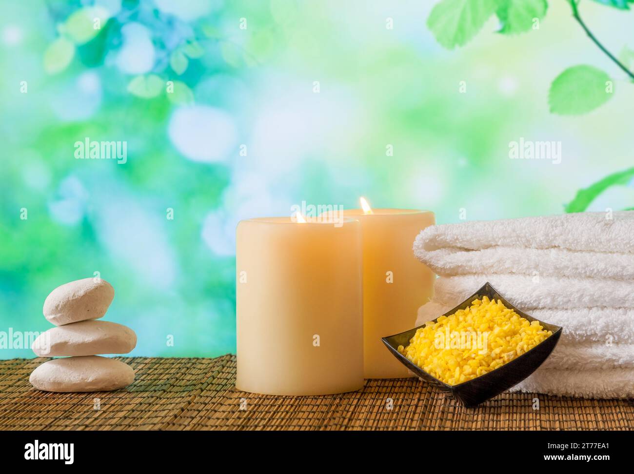 Spa massage border background with towel stacked, candles and sea salt ...